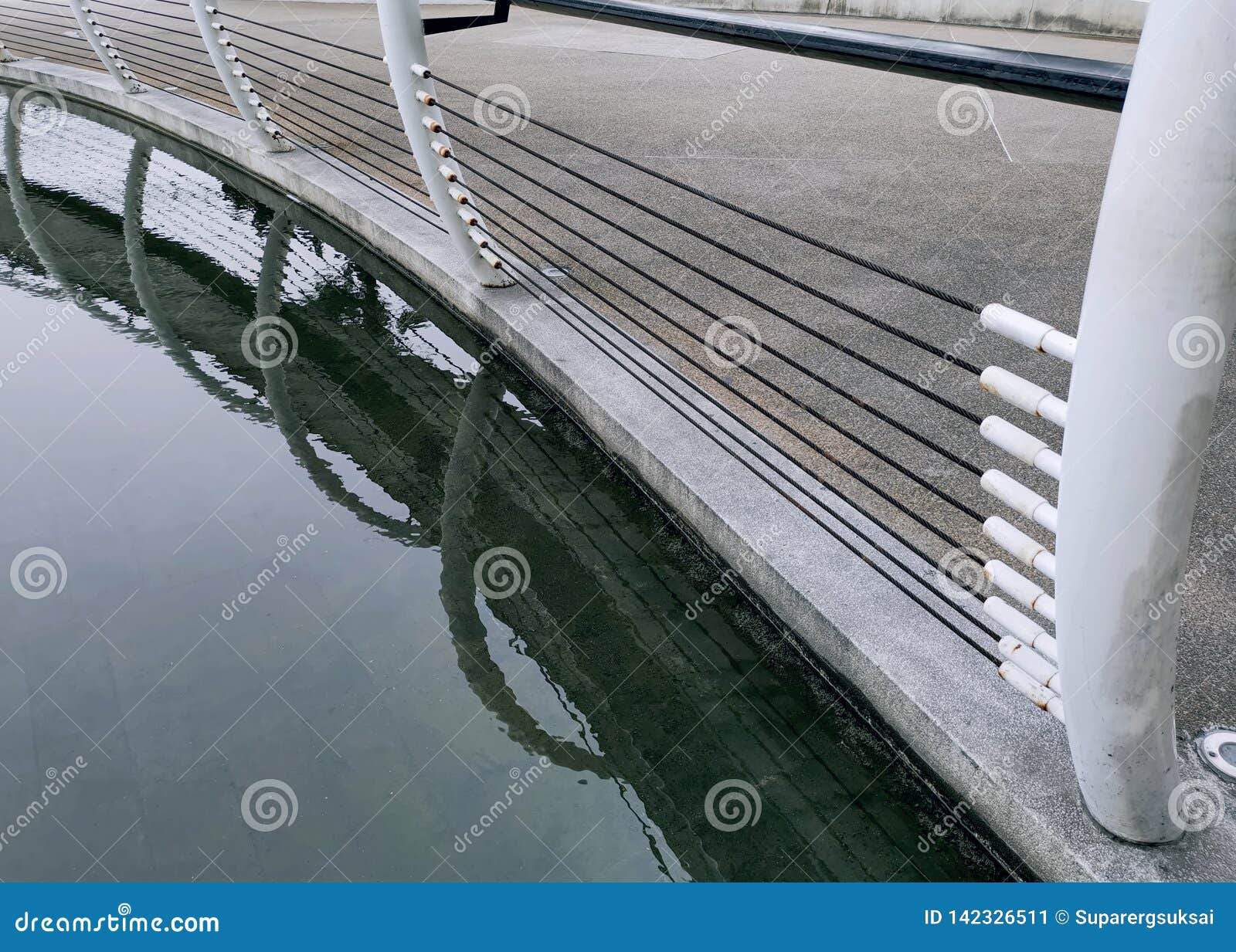 Curved Walkway Along the Pool with Reflection Over Water Stock Image ...