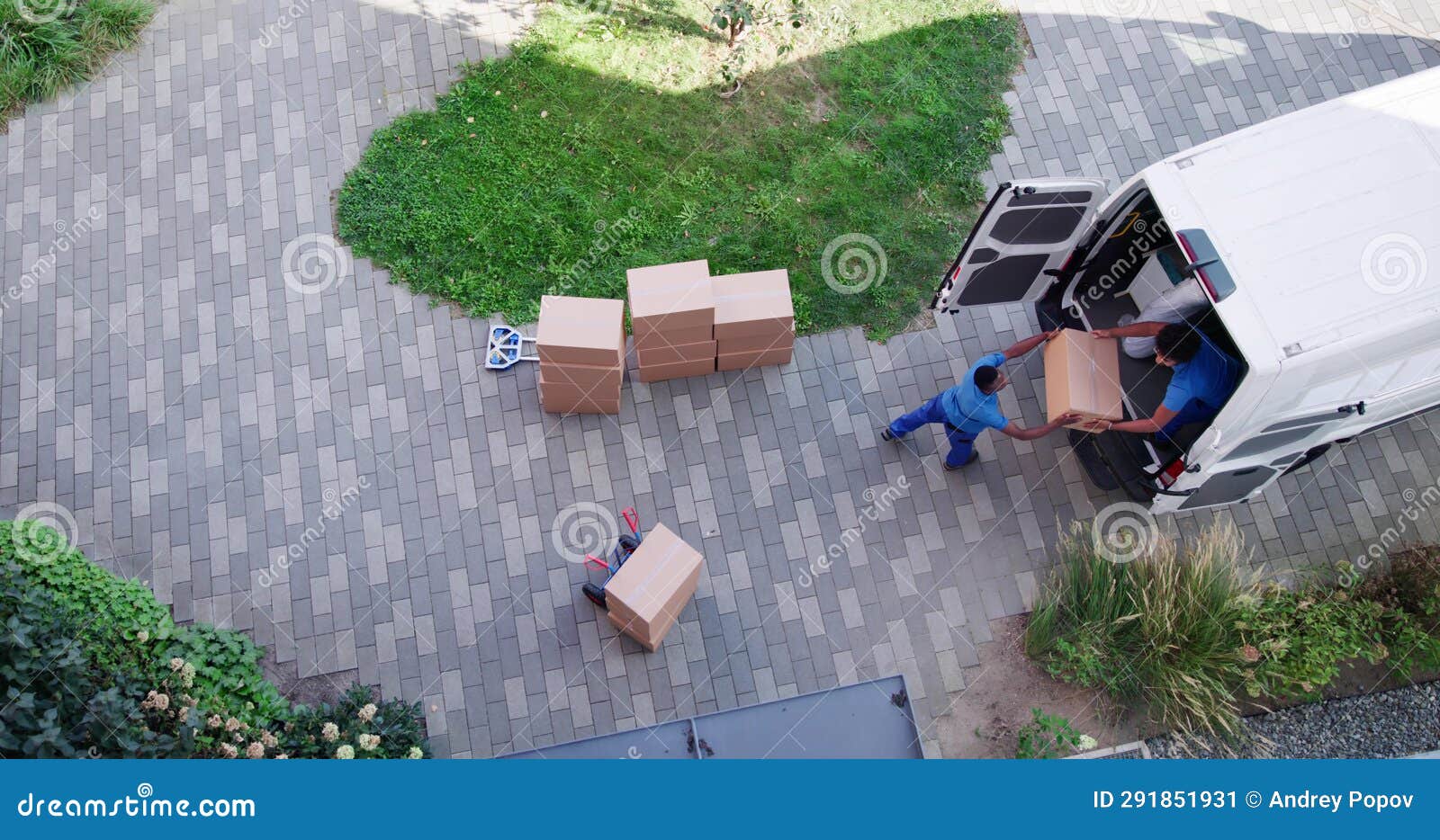 High Angle View of Delivery Men Unloading the Cardboard Boxes Stock ...