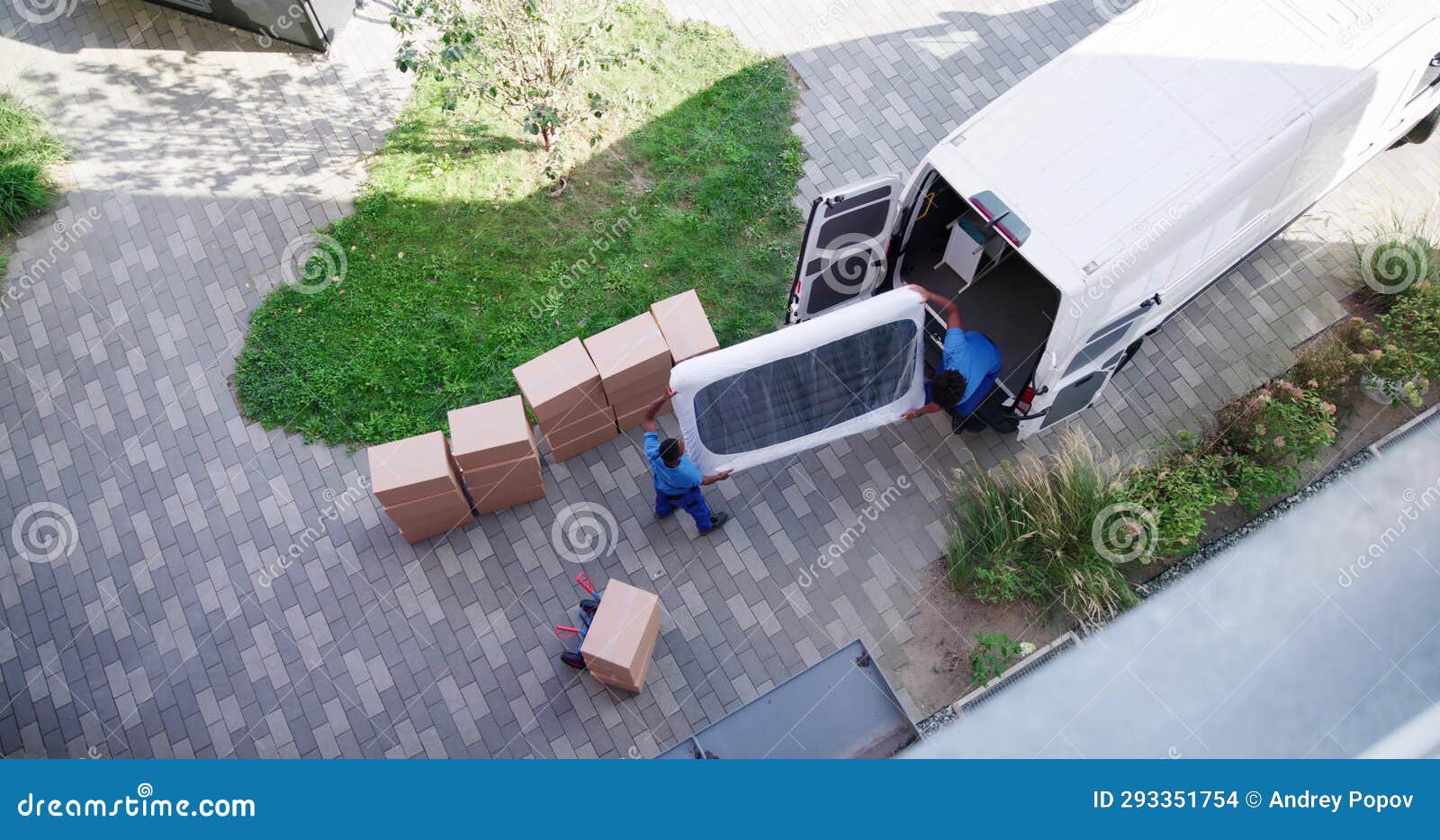 High Angle View of Delivery Men Unloading the Cardboard Boxes Stock ...