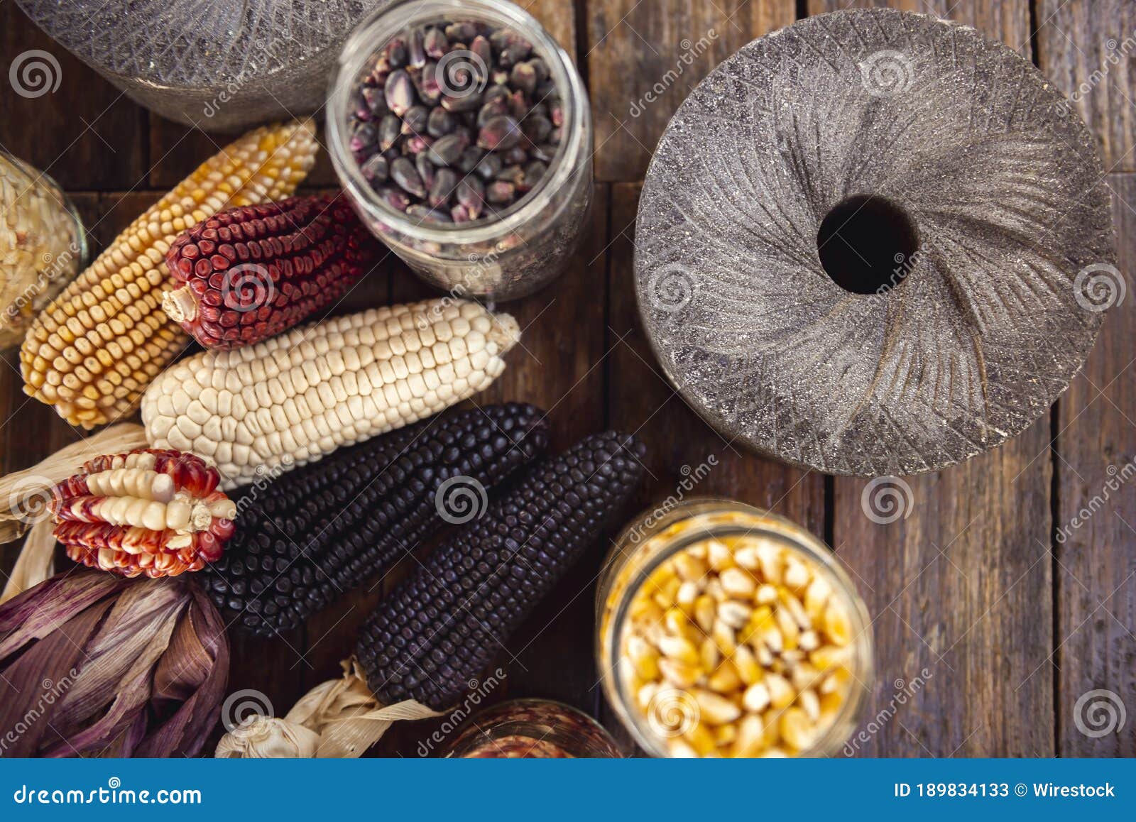 High Angle View of Different Corn Types and Kernel in a Jar on a Wooden ...