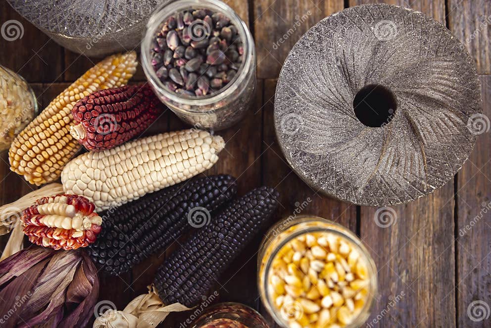 High Angle View of Different Corn Types and Kernel in a Jar on a Wooden ...