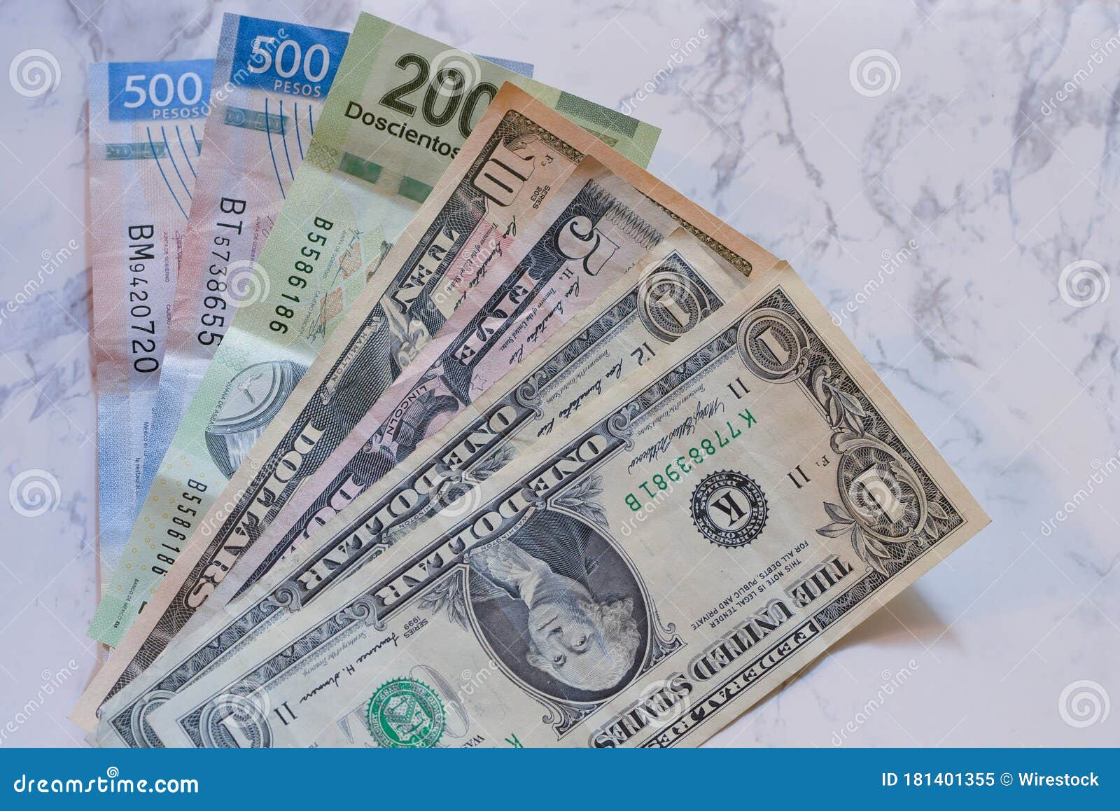 High Angle View of Dollars and Pesos on the Table Under the Lights ...