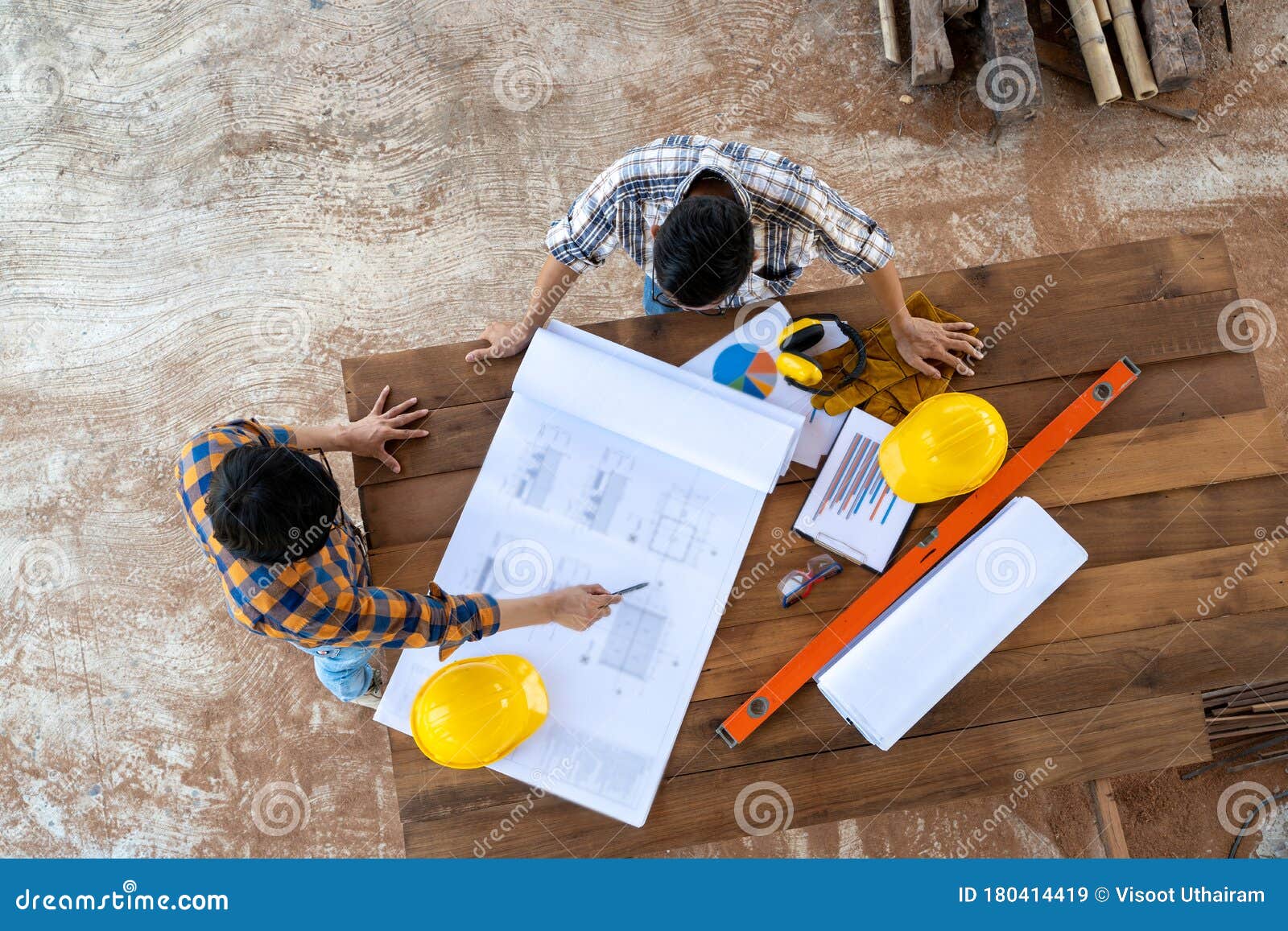 High Angle View of Engineer and Architect Discussing Building Plan at ...