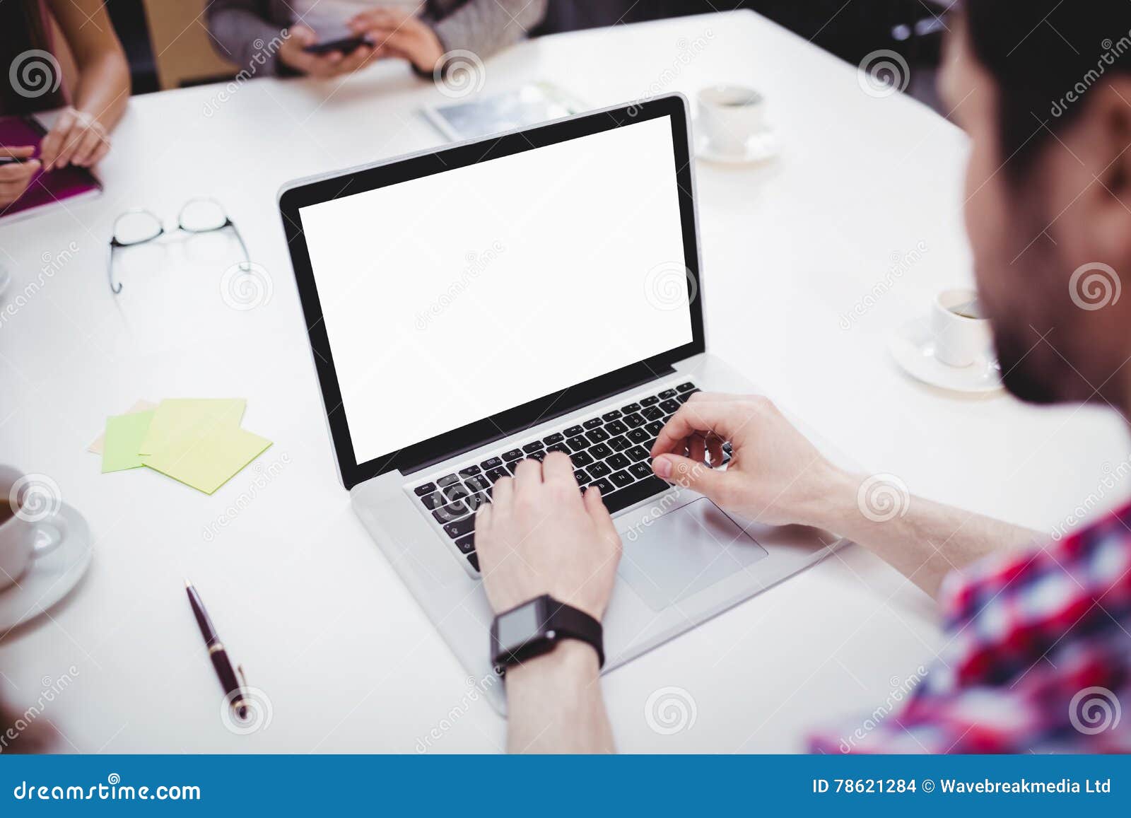High Angle View of Executive Using Laptop in Meeting Room at Creative ...
