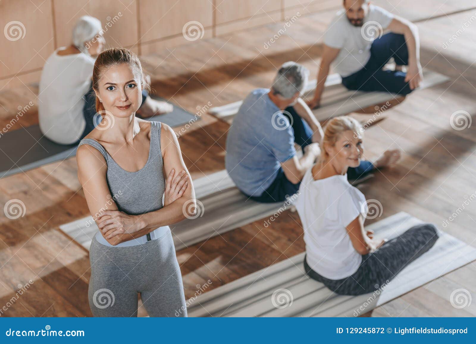 High Angle View of Female Instructor Looking at Camera while Senior ...