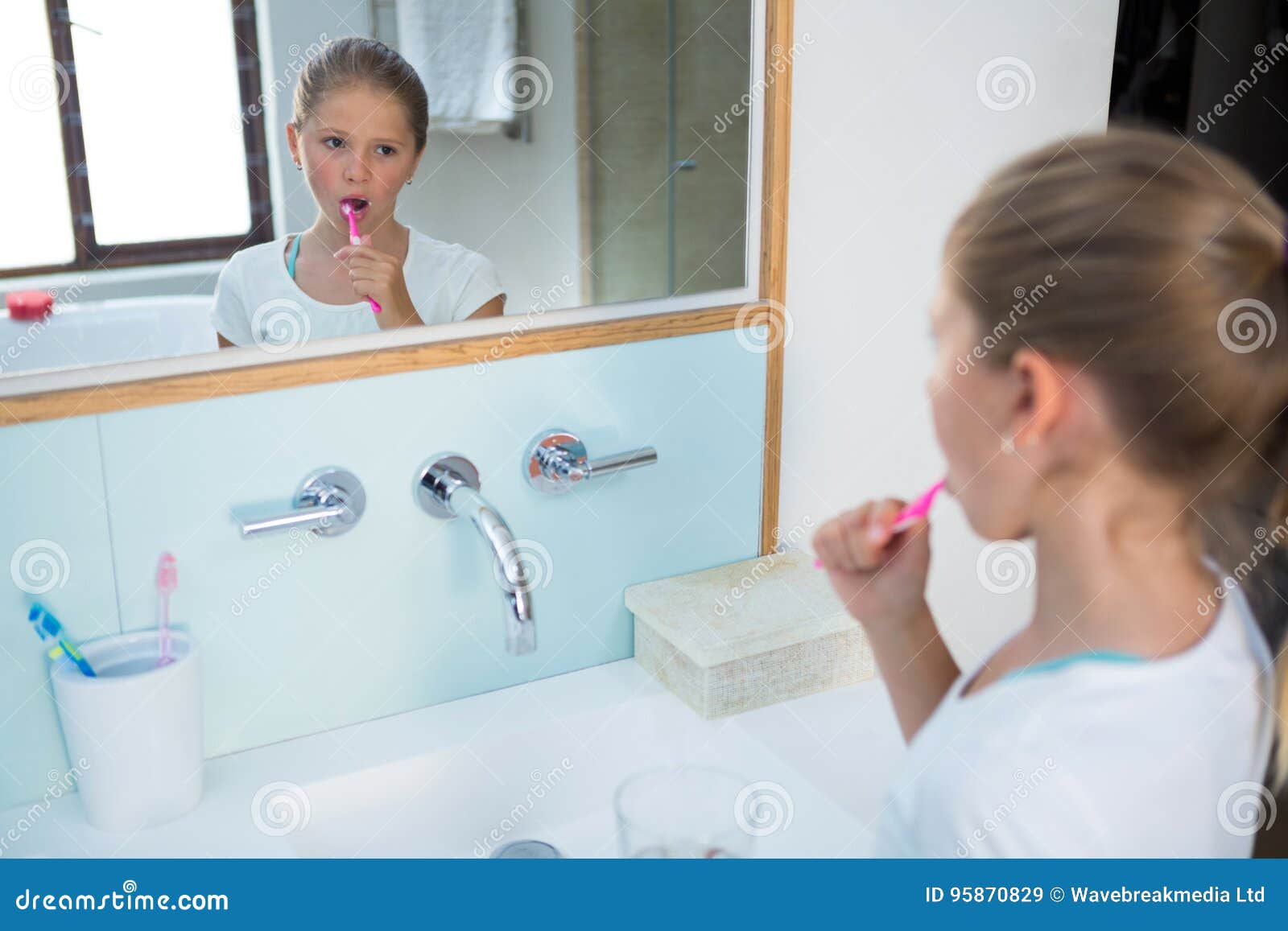 High Angle View of Girl Brushing Teeth Stock Image - Image of container ...