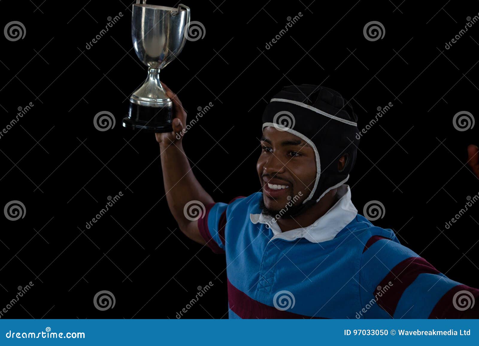 High Angle View of Happy Rugby Player Holding Trophy Stock Photo ...