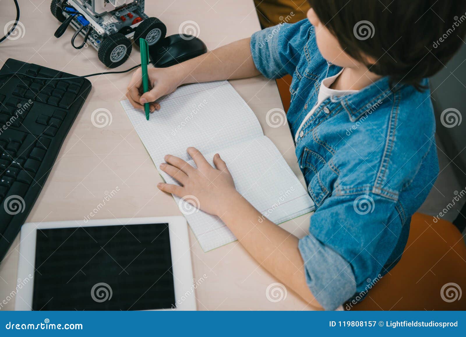 High Angle View Kid Writing in Notebook Stock Image - Image of ...