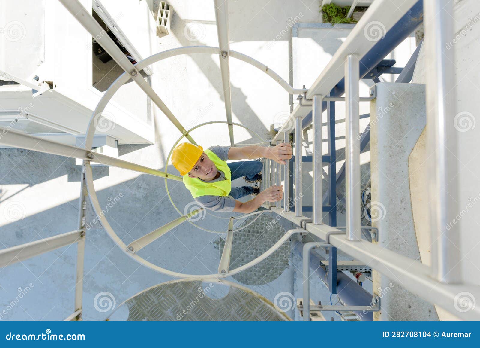 High Angle View Man Climbing Ladder in Curcular Framework Stock Photo ...