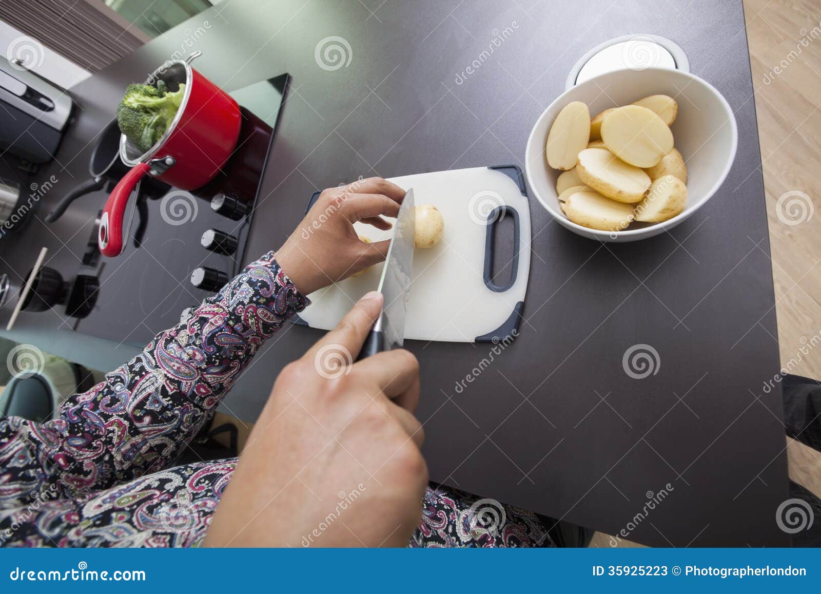 High Angle View of Man Cutting Potato at Kitchen Counter Stock Image ...