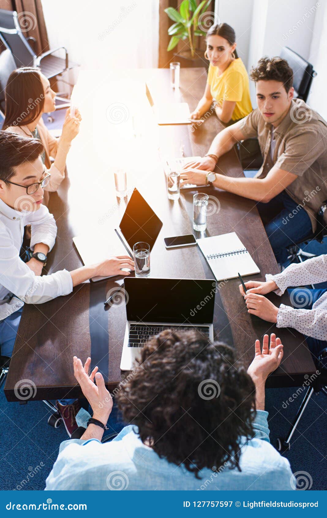 High Angle View of Multicultural Business Partners Having Meeting at ...