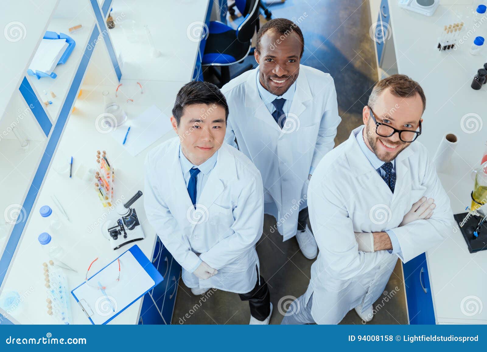 High Angle View of Multiracial Group of Scientists Standing Together ... High Angle View of Multiracial Group of Scientists Standing Together ...