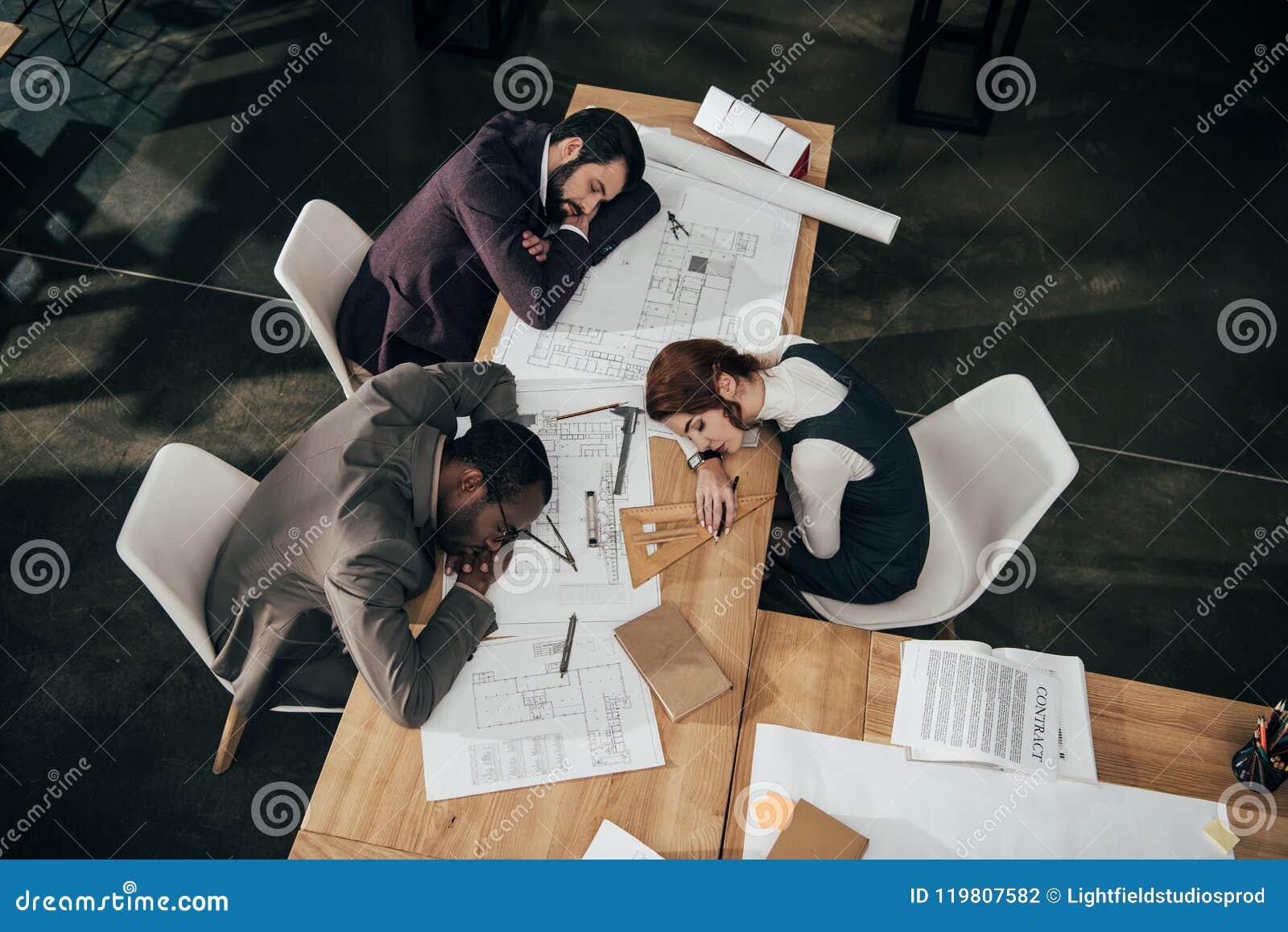 High Angle View of Overworked Team of Architects Sleeping Stock Photo ...