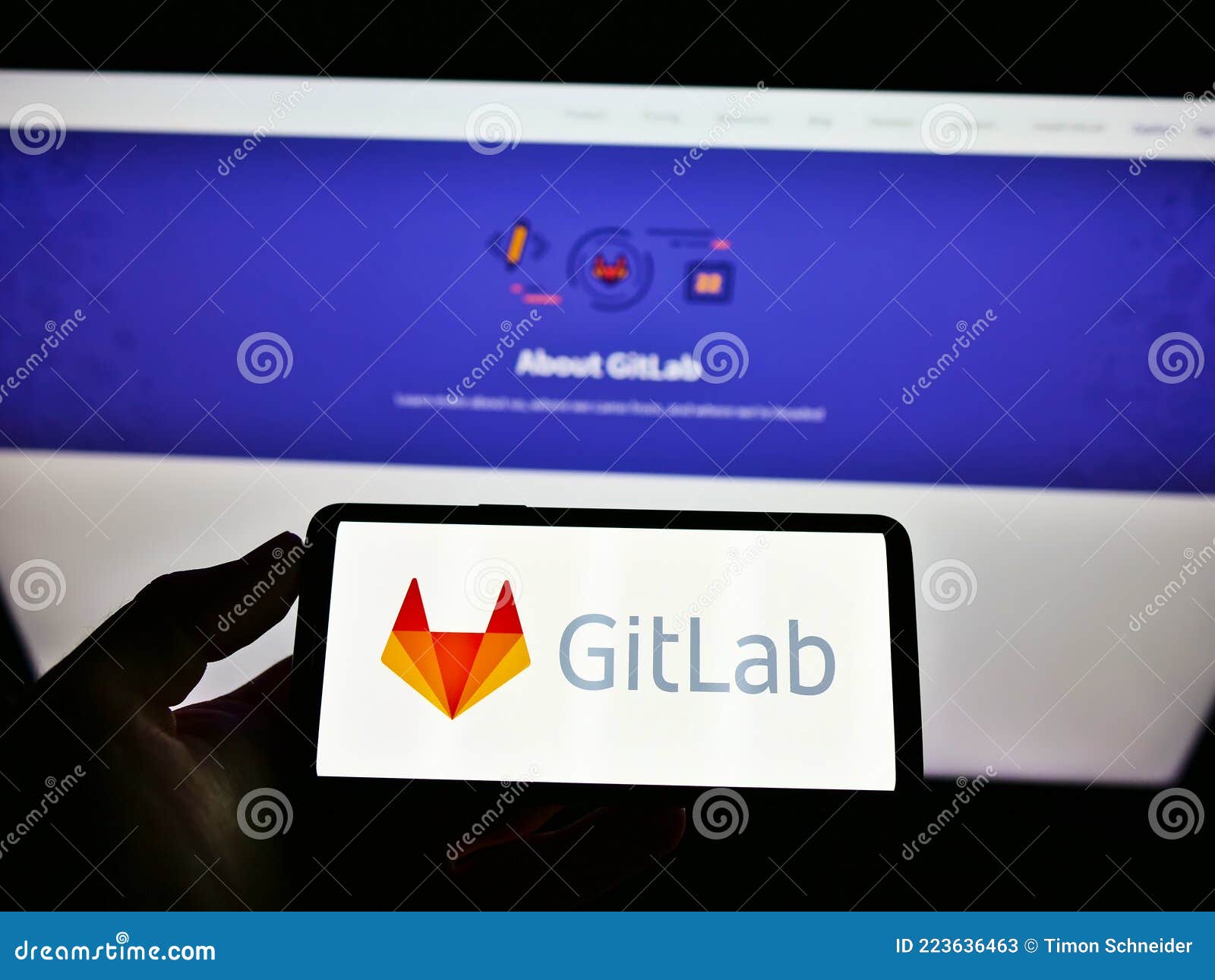 High Angle View of Person Holding Mobile Phone with Logo of US DevOps ...