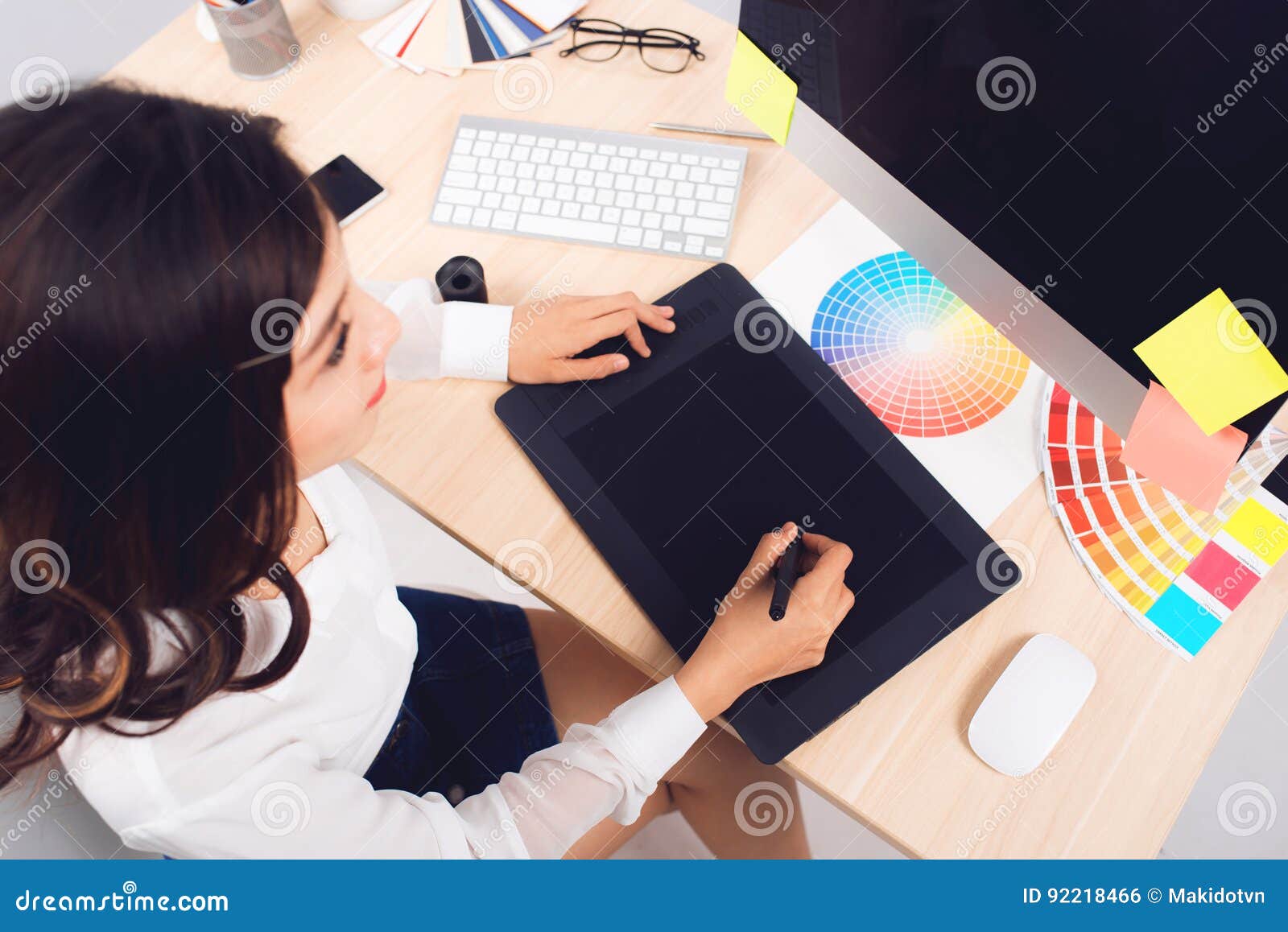 High Angle View of a Photo Editor Working at Desk in Creative of Stock ...
