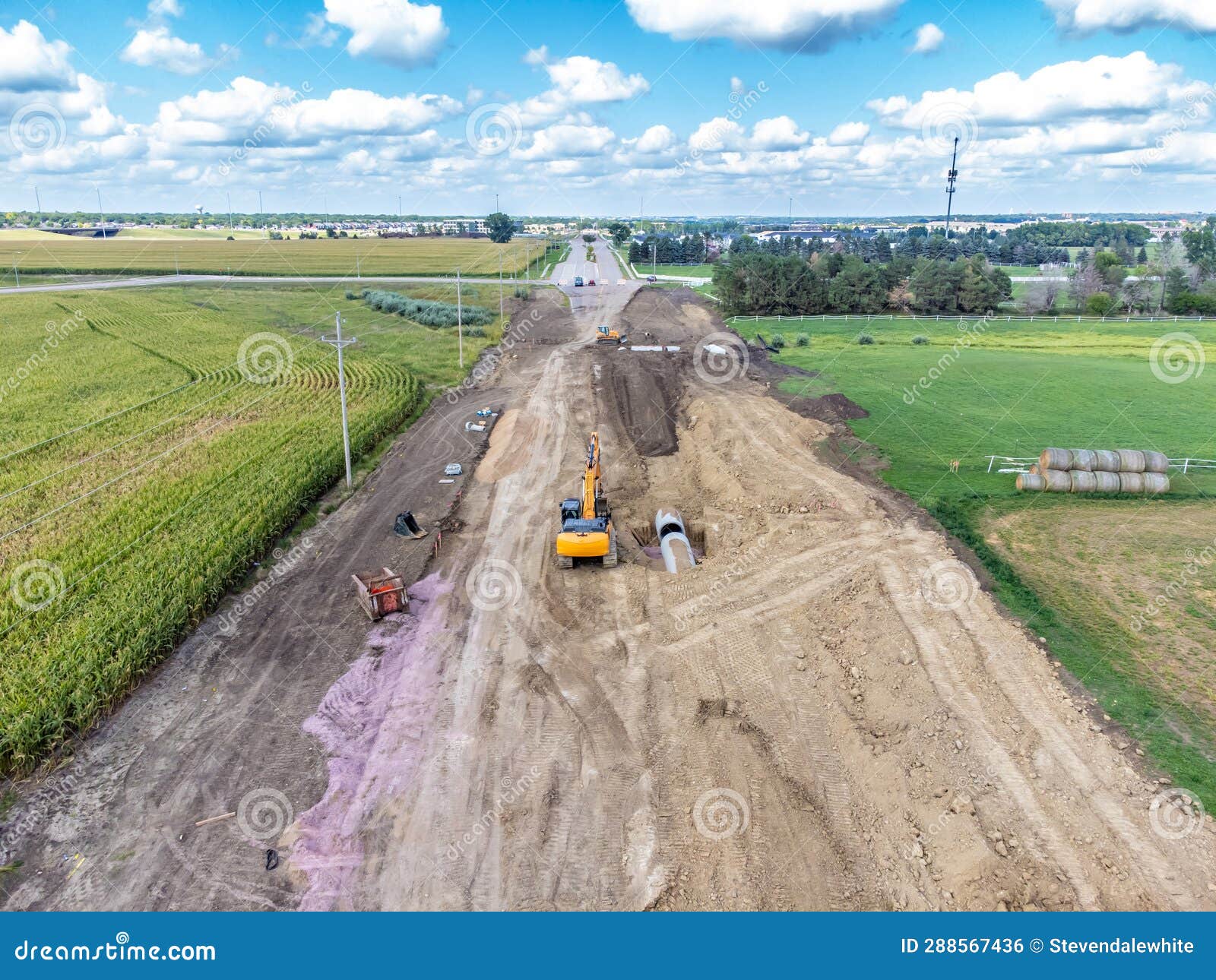 High Angle View of a Road Construction Project Starting in a Corn Field ...