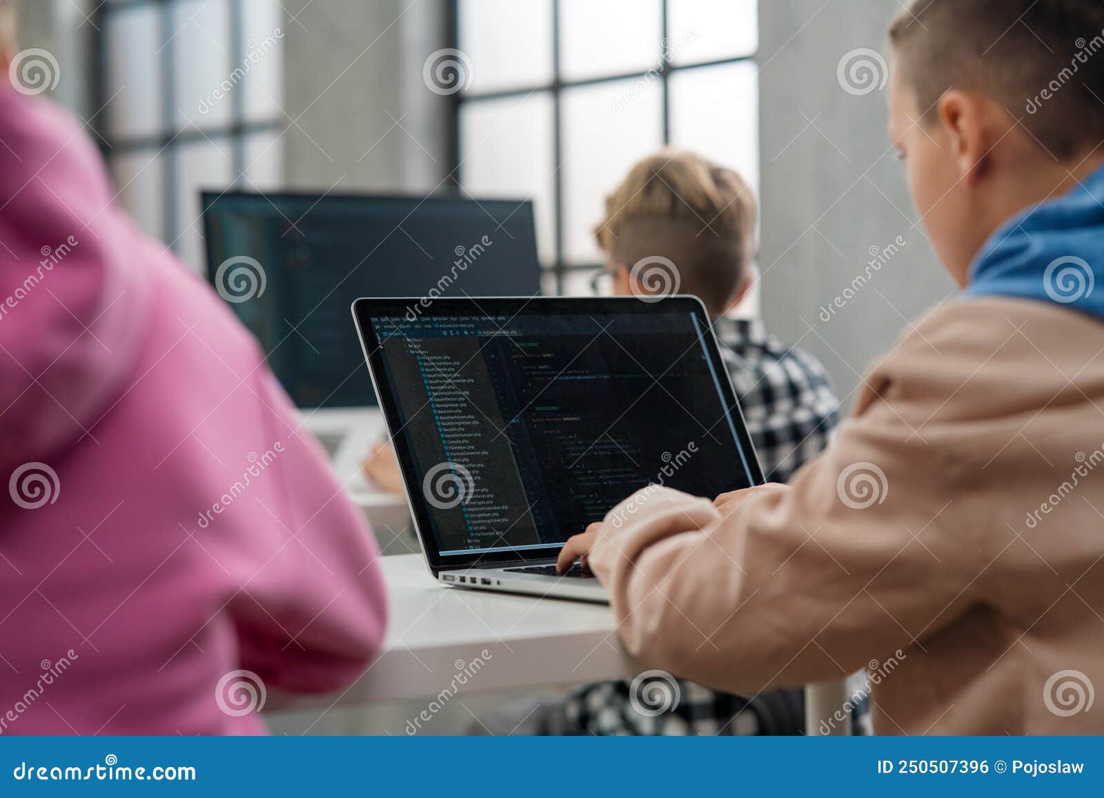 High Angle View of School Kids Using Computer in Classroom at School ...