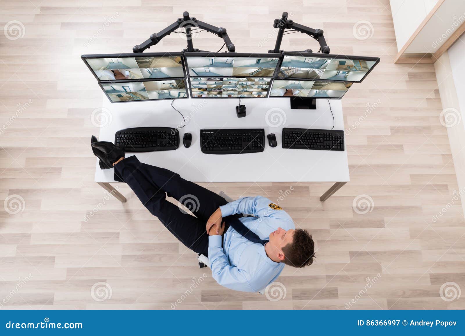 Security Guard Sleeping in Office Stock Image - Image of cameras, chair ...