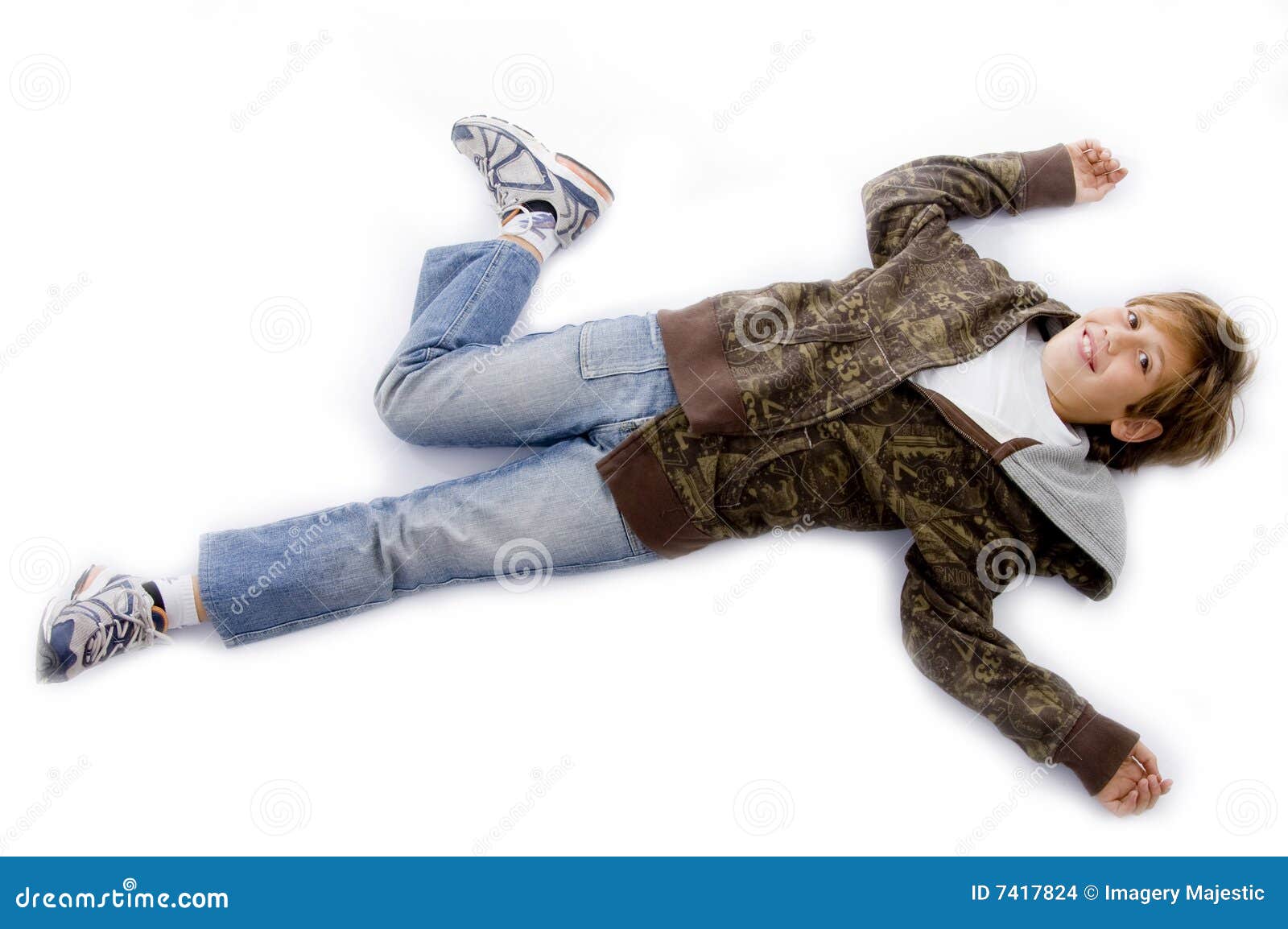 High Angle View of Small Kid Lying Down on Floor Stock Photo - Image of ...