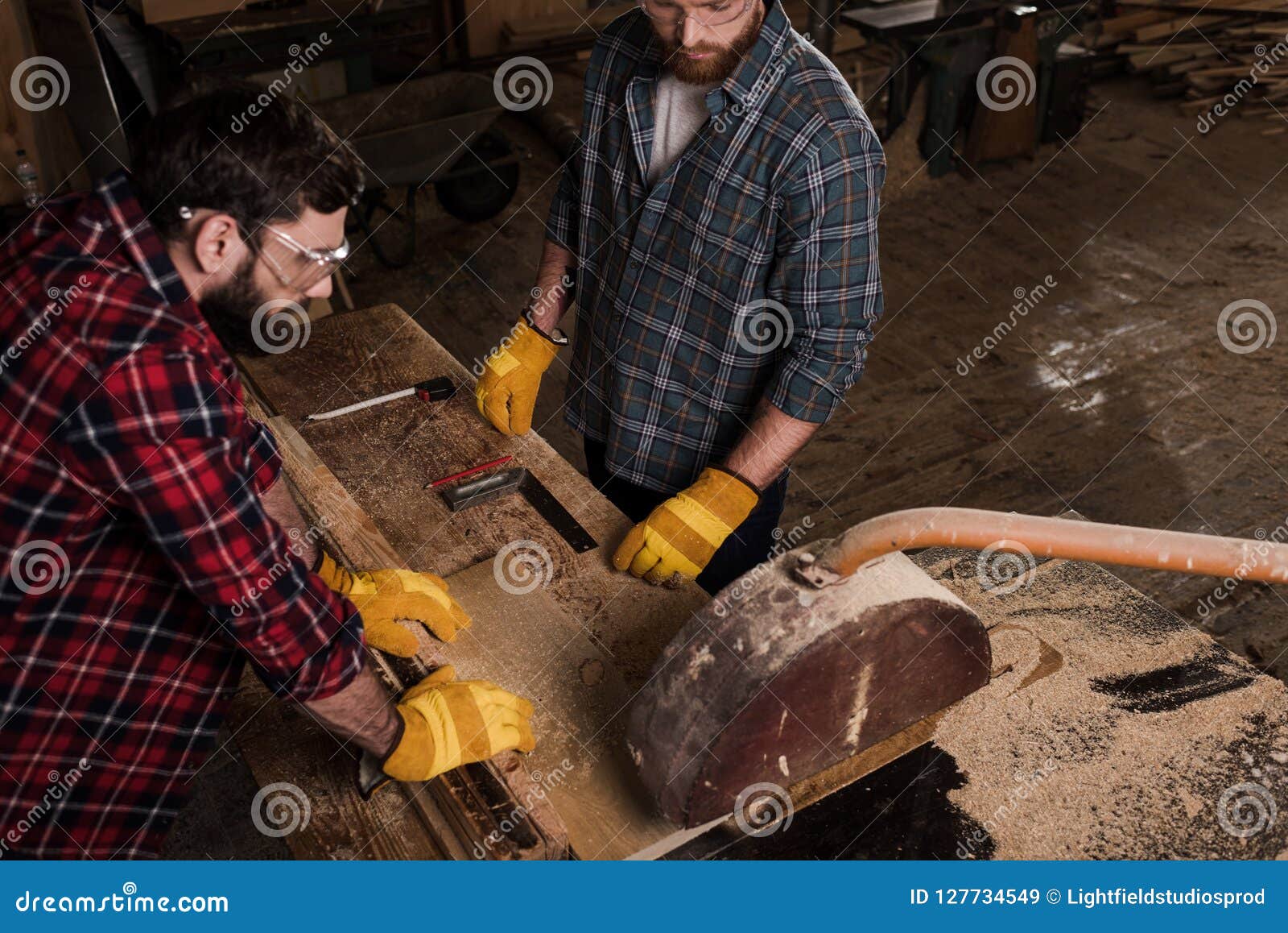 High Angle View of Two Carpenters Using Machine Saw Stock Image - Image ...