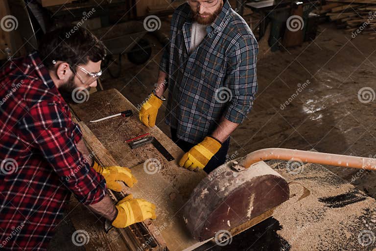 High Angle View of Two Carpenters Using Machine Saw Stock Image - Image ...