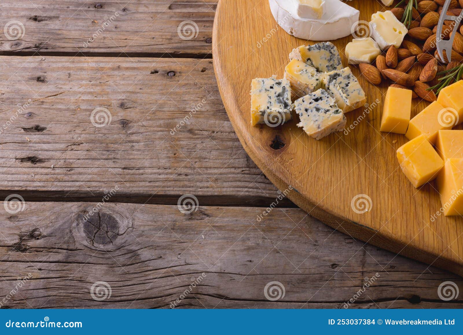 High Angle View of Various Cheese with Almonds on Table, Copy Space ...