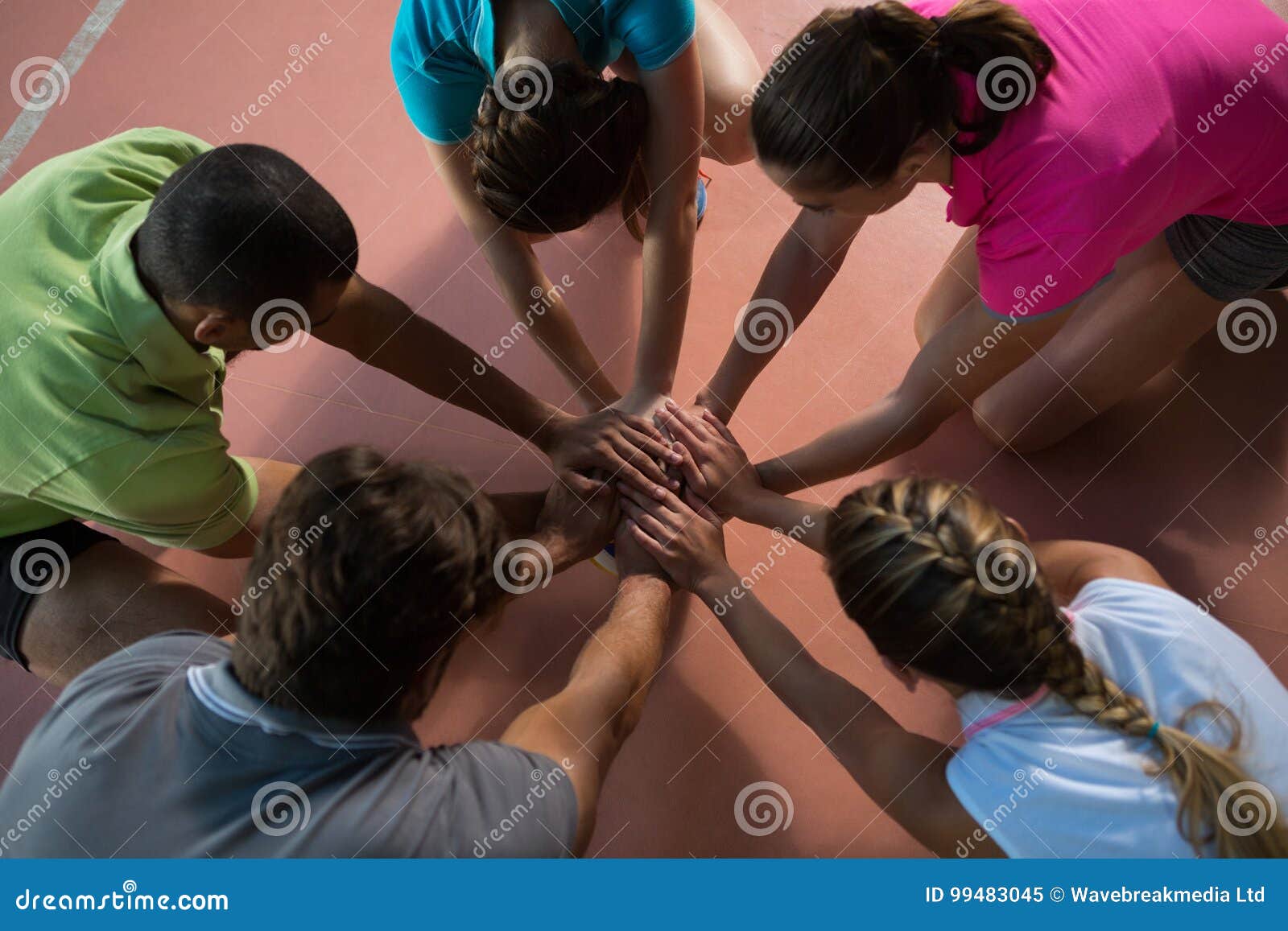 High Angle View of Volleyball Players Stacking Hands Stock Image ...