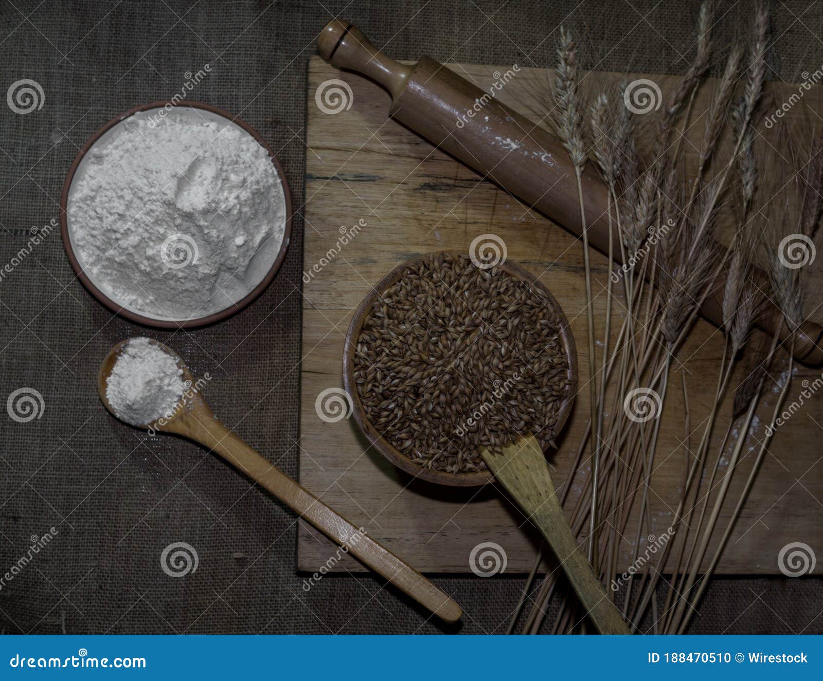High Angle View of Wheat and Flour in Bowls on the Table with a Rolling ...