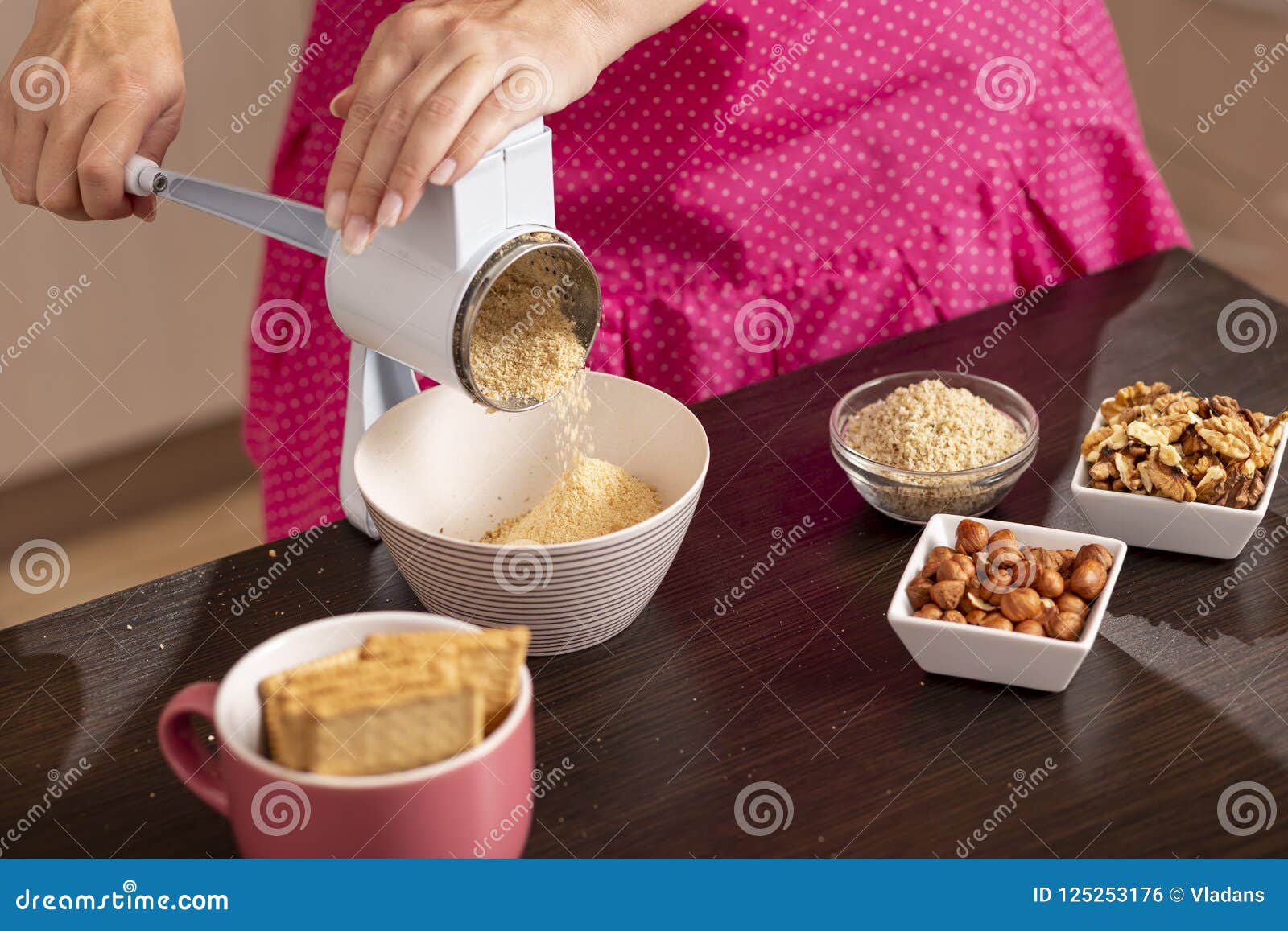 Woman grinding biscuits stock photo. Image of girl, angle - 125253176