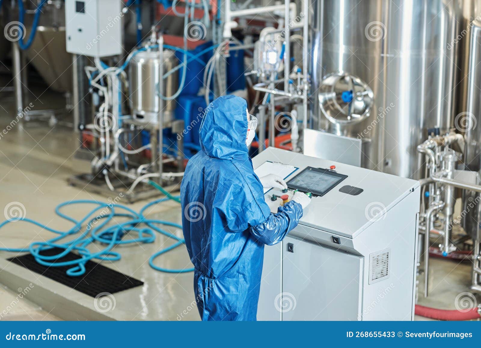 High Angle View at Worker in Protective Gear Operating Equipment at ...