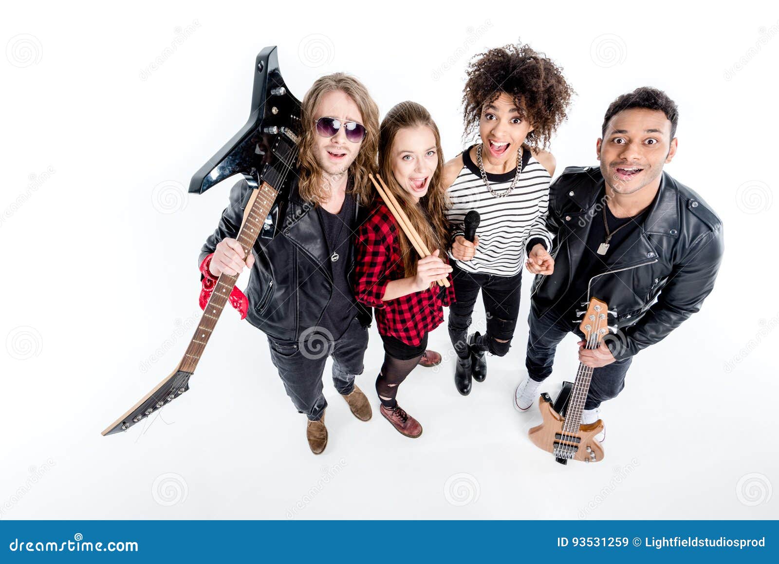High Angle View of Young Rock and Roll Band Standing with Microphone ...