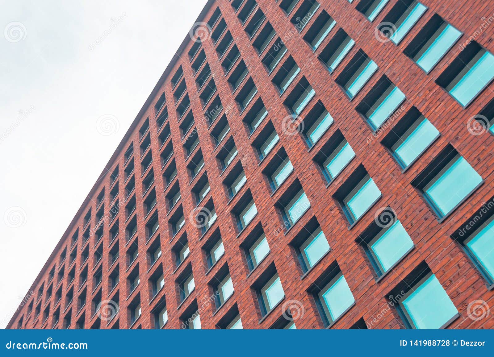 High Brick Wall with Square Windows and Glass Stock Photo - Image of ...