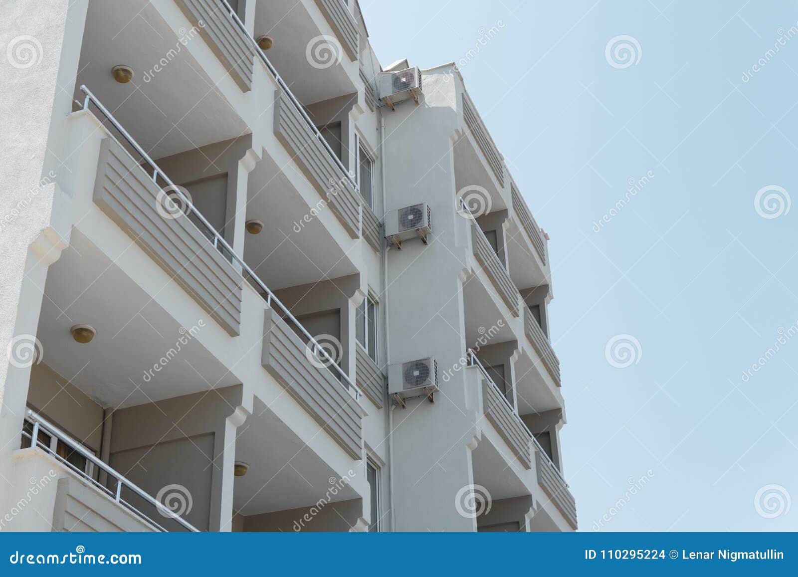 High Building with Balconies Against a Clear Sky Background Stock Photo ...