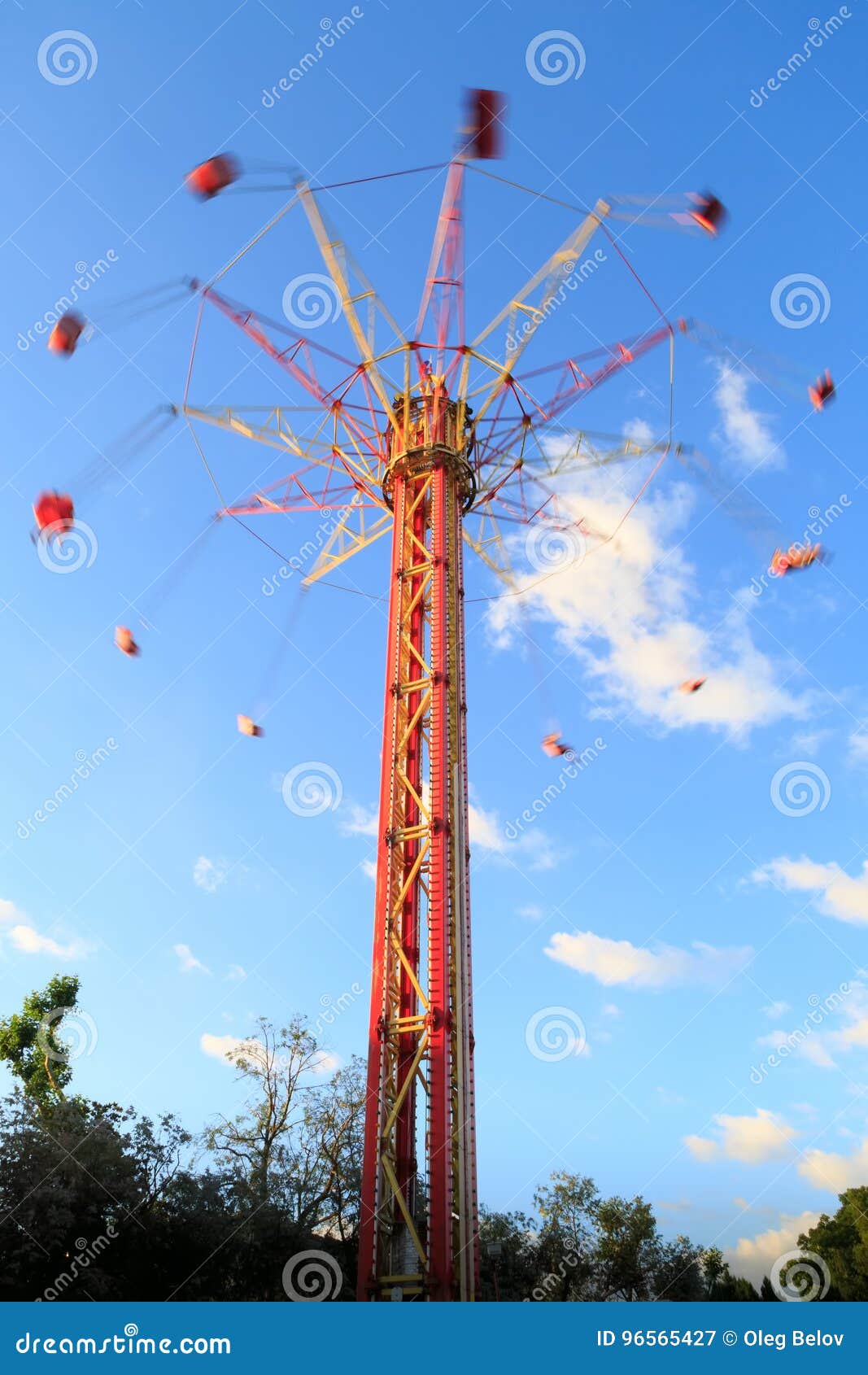 High Carousel is Whirling on the Background of Blue Sky in Park Stock ...
