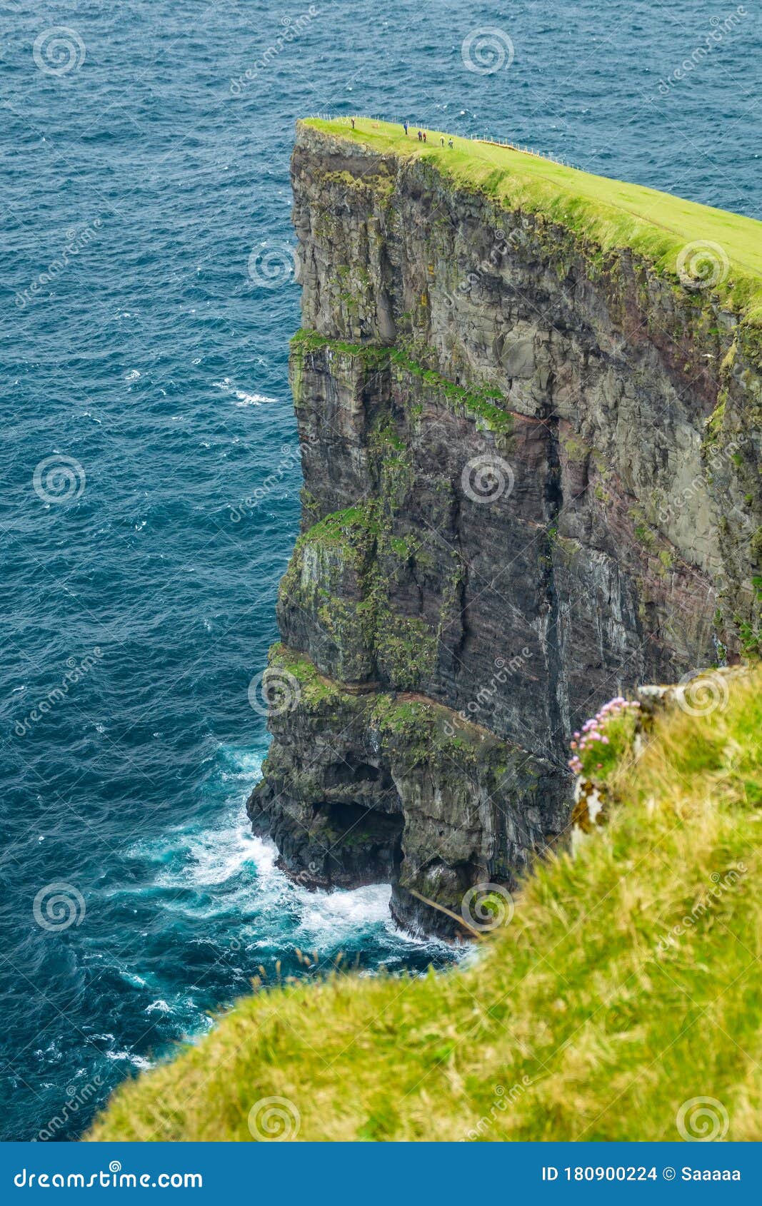 High Cliffs Over the Ocean with Small Tourists Stock Photo - Image of ...