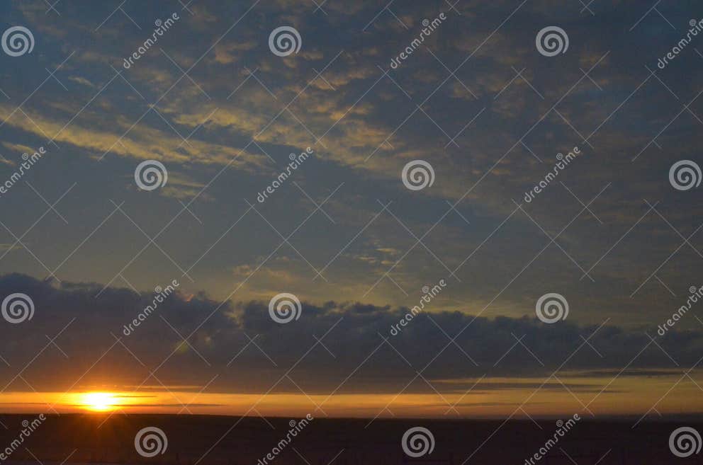 Sunsetting high clouds stock photo. Image of setting - 321837480