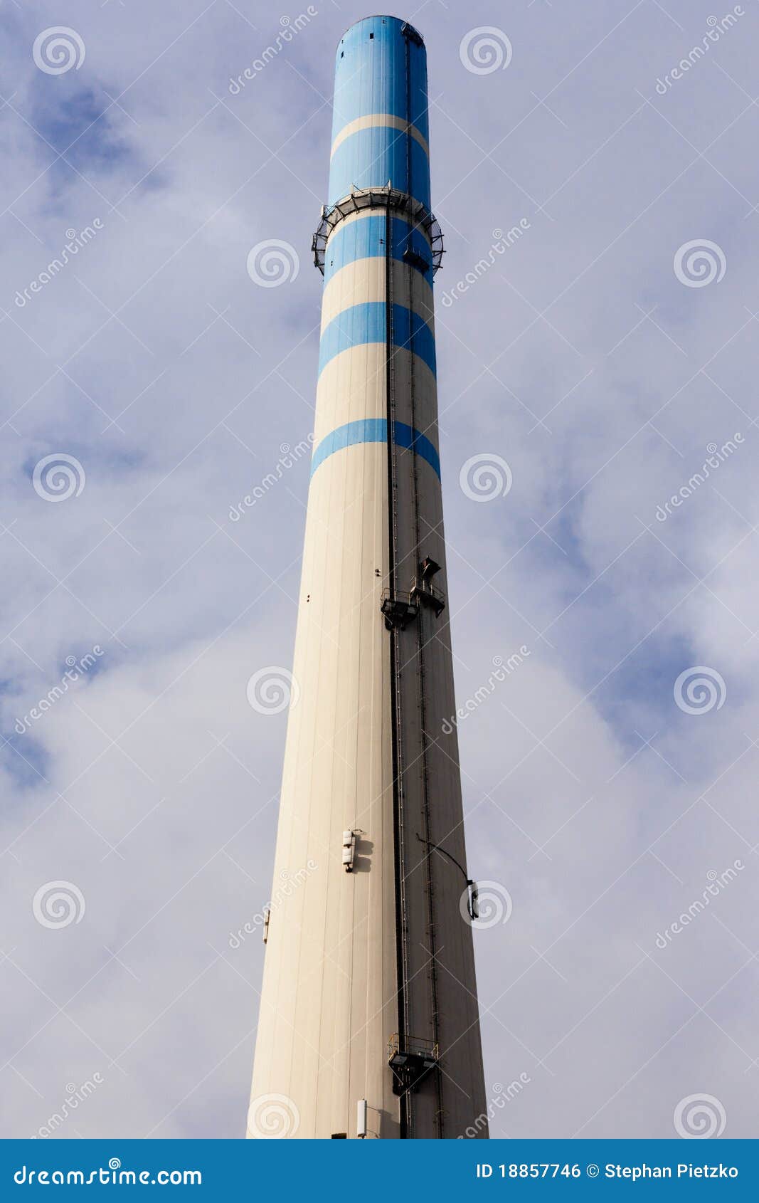 High Concrete Structure Of Cement Factory With Tower Crane And Smoking ...