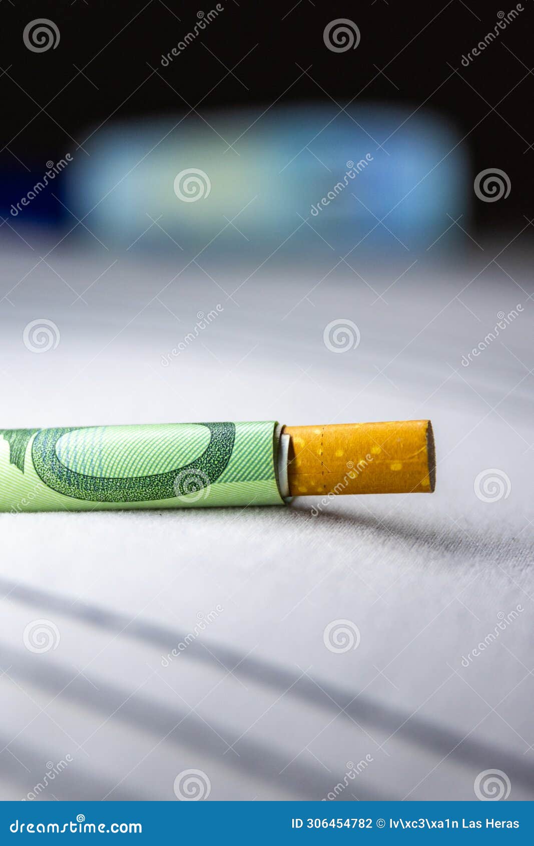 High Cost of Smoking: Cigarette Wrapped in a 100 Euro Bill Stock Photo ...