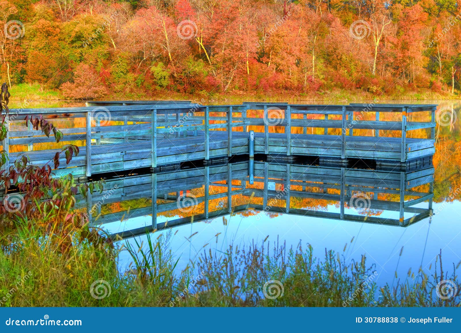 High Dynamic Range of a Boat Dock and Fall Colors Stock Photo - Image ...