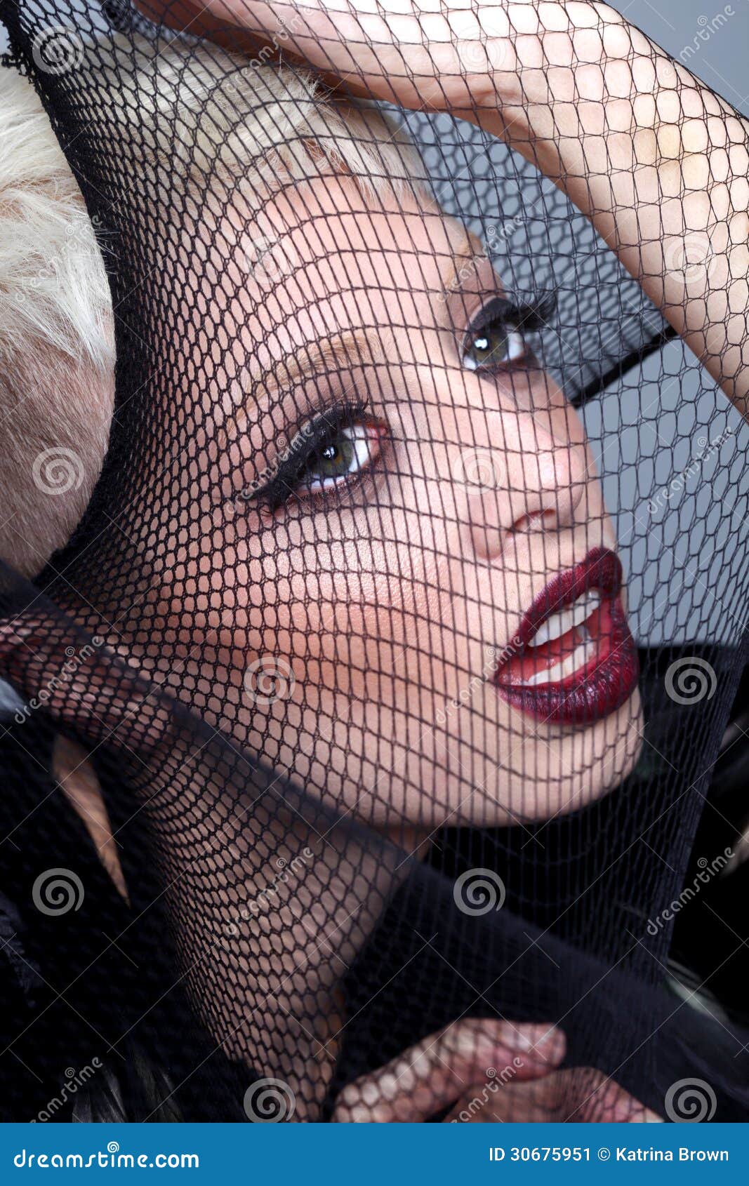High Fashion Model Stretching Netting Over Her Face Stock Image - Image ...