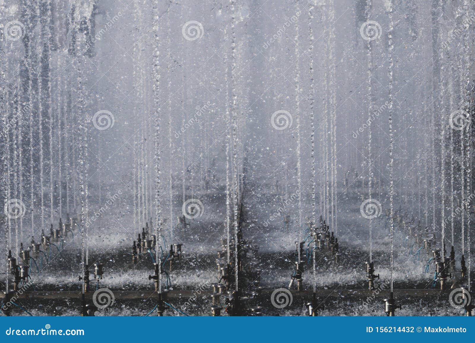 High Fountain Spraying Water in the Park. Fountain Spray System Stock ...