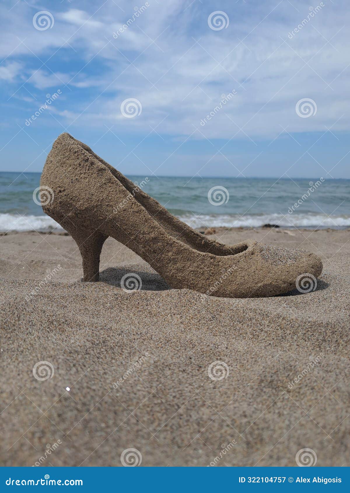High Heel Shoe Sand Sculpture on the Shore at the Beach Editorial ...