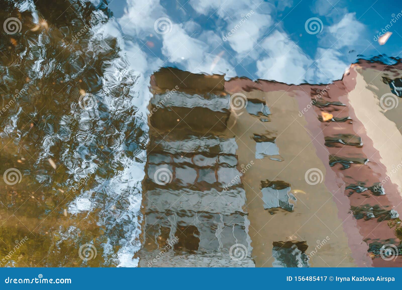 High House Reflection and Blue Sky in a Puddle after a Rain Stock Image ...