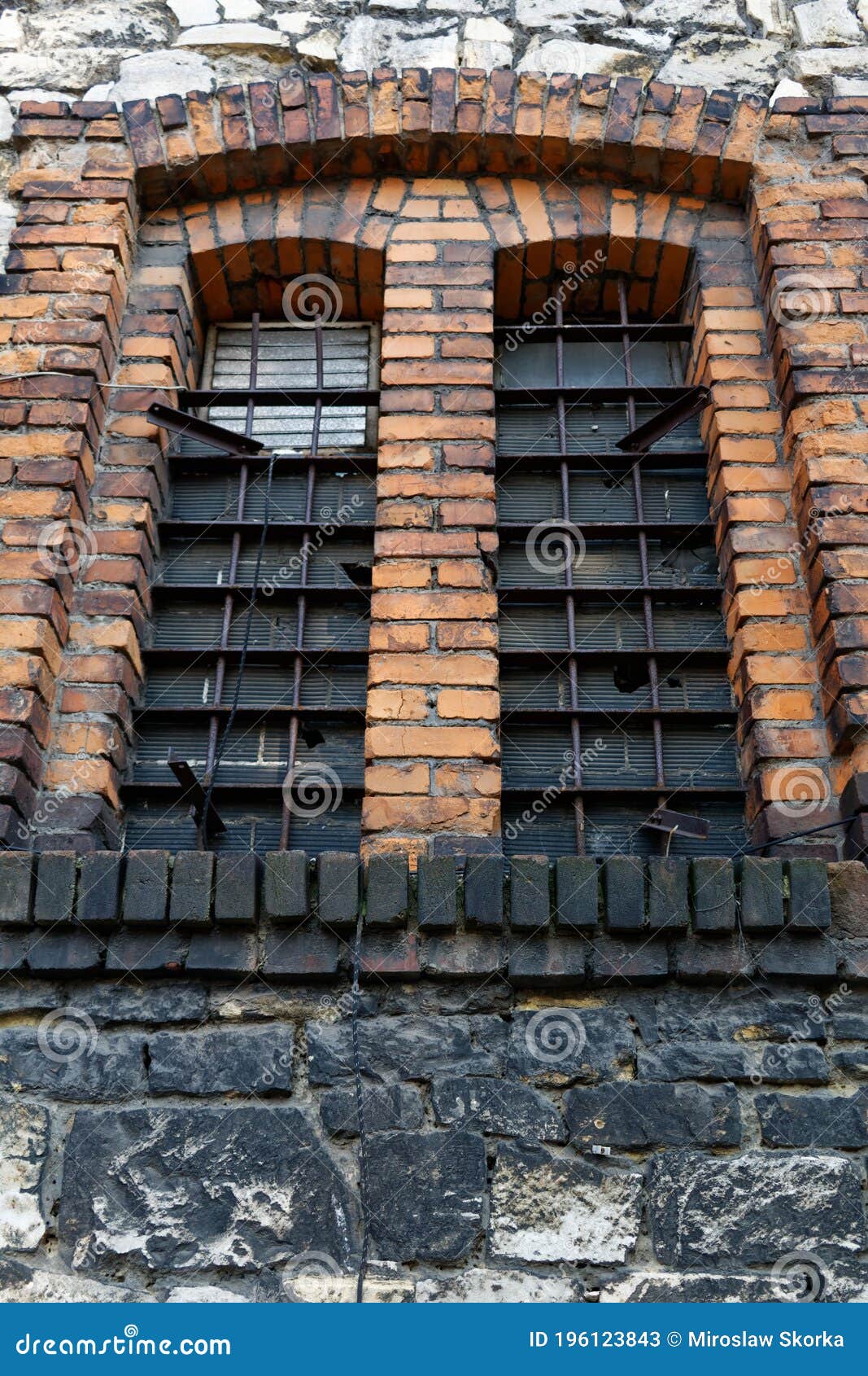 High Industrial Double Window, Barred, In Brick Wall Stock Image ...