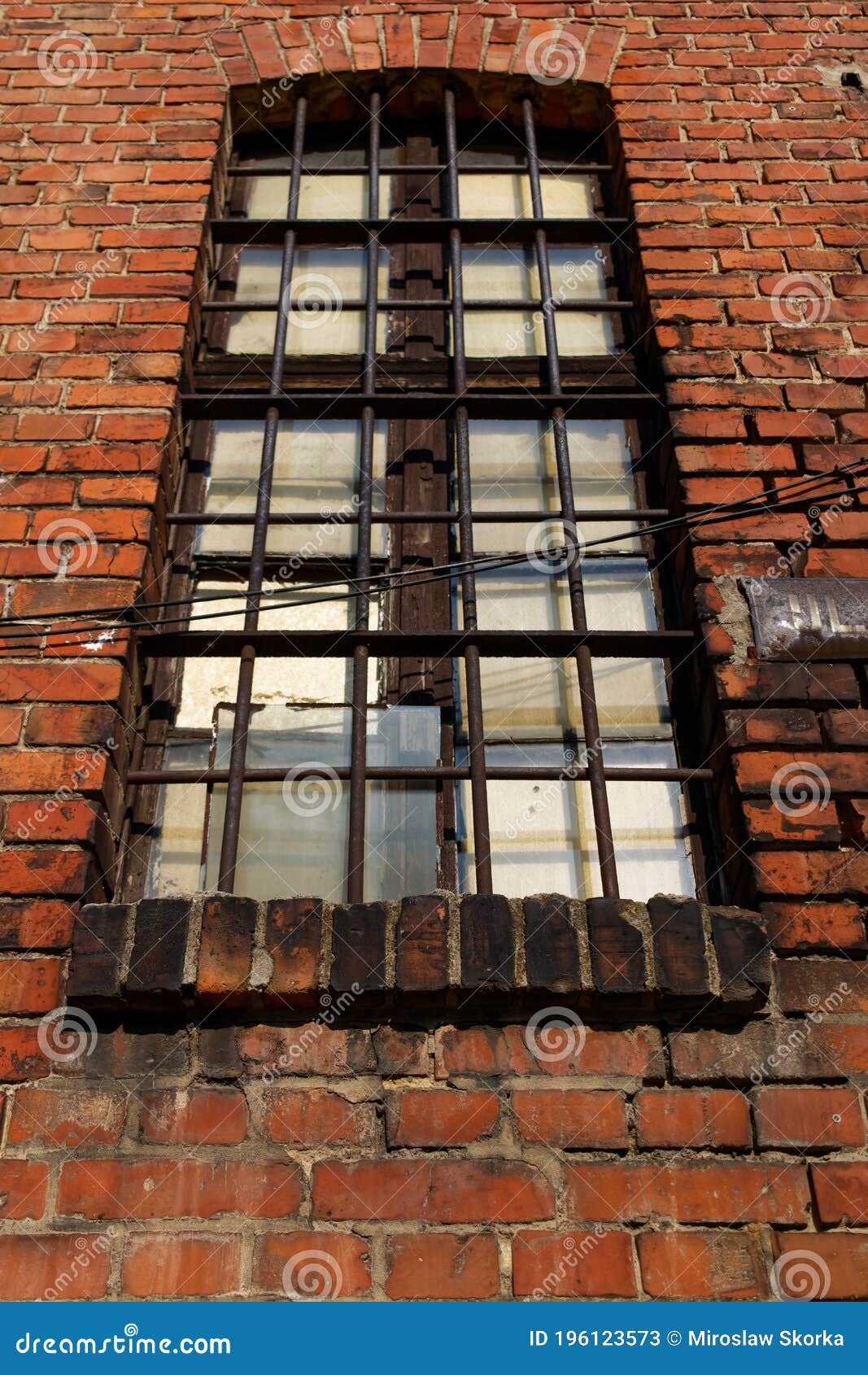 High Industrial Double Window, Barred, In Brick Wall Stock Image ...