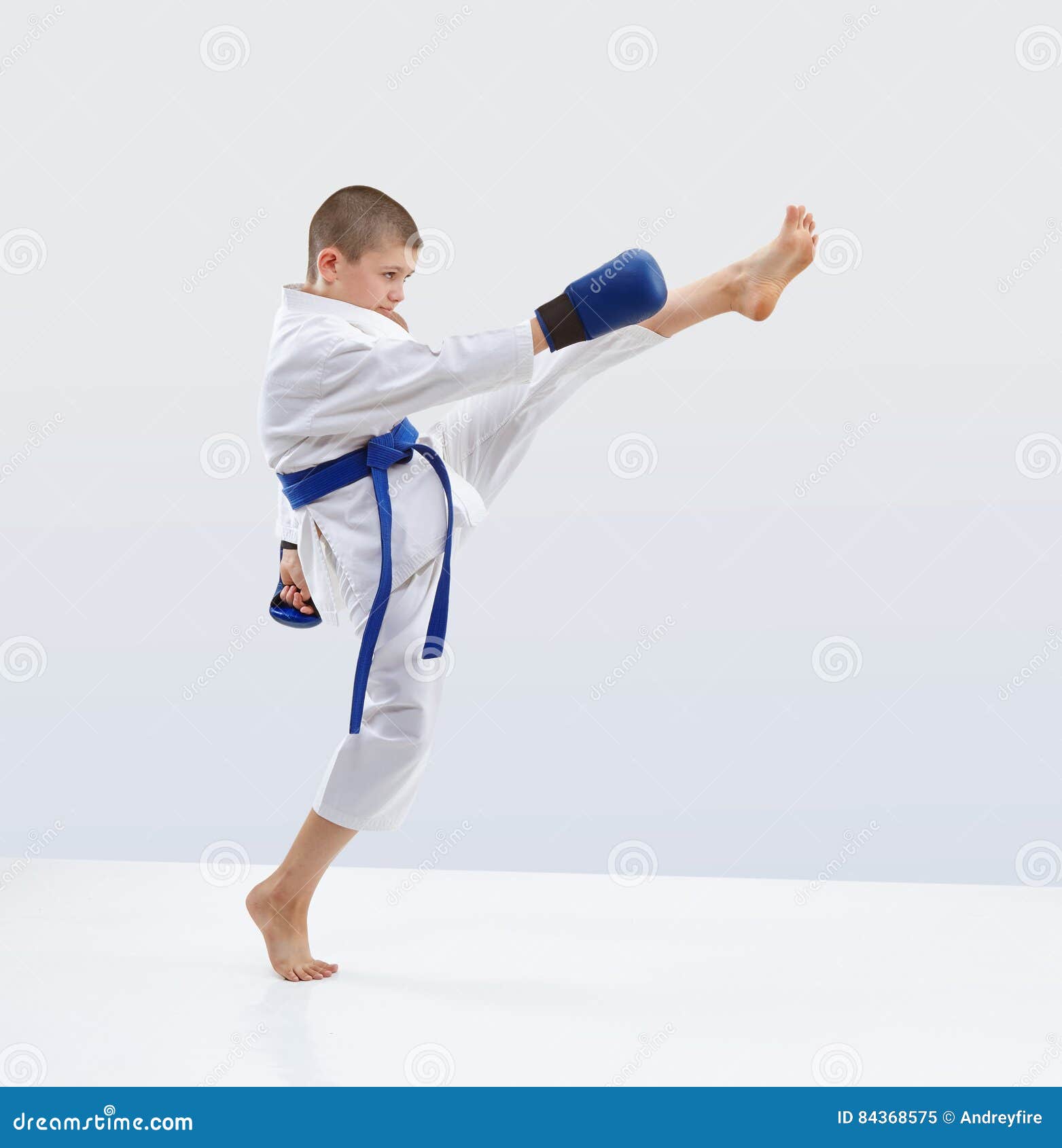 High Kick Forward Karateka is Beating in Karategi Stock Image - Image ...