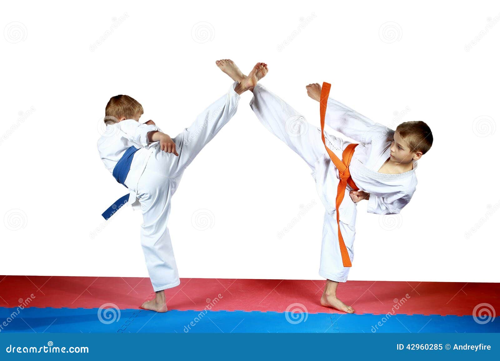 High Kicks Legs Two Athletes are Training on the Red and Blue Mat Stock ...