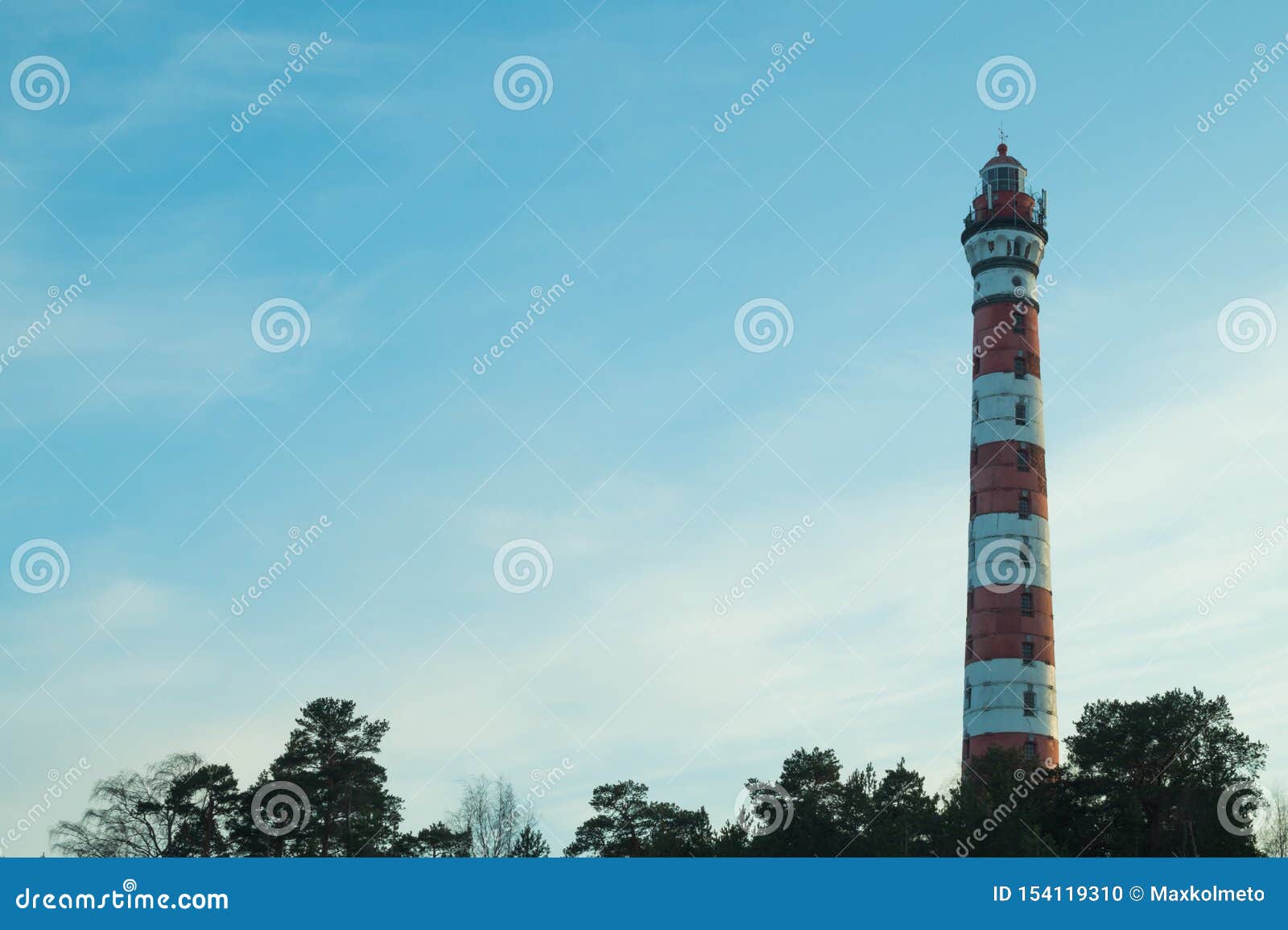 High Lighthouse in the Forest Landscape. Red and White Lighthouse Stock ...