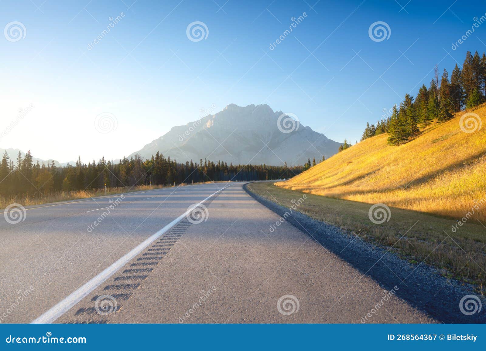 High Mountains on the Horizon. Bright Sun during Sunset. Direction of ...