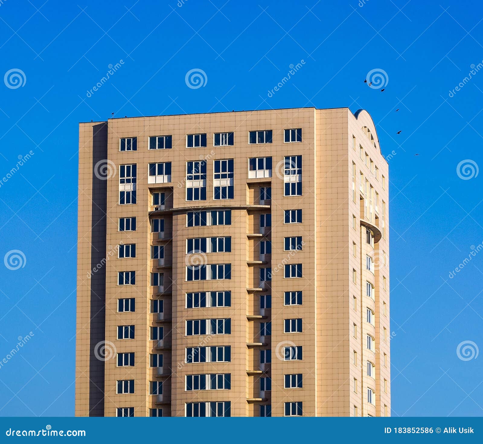 High Multi Storey Building Against Blue Sky in Sunny Day Editorial ...